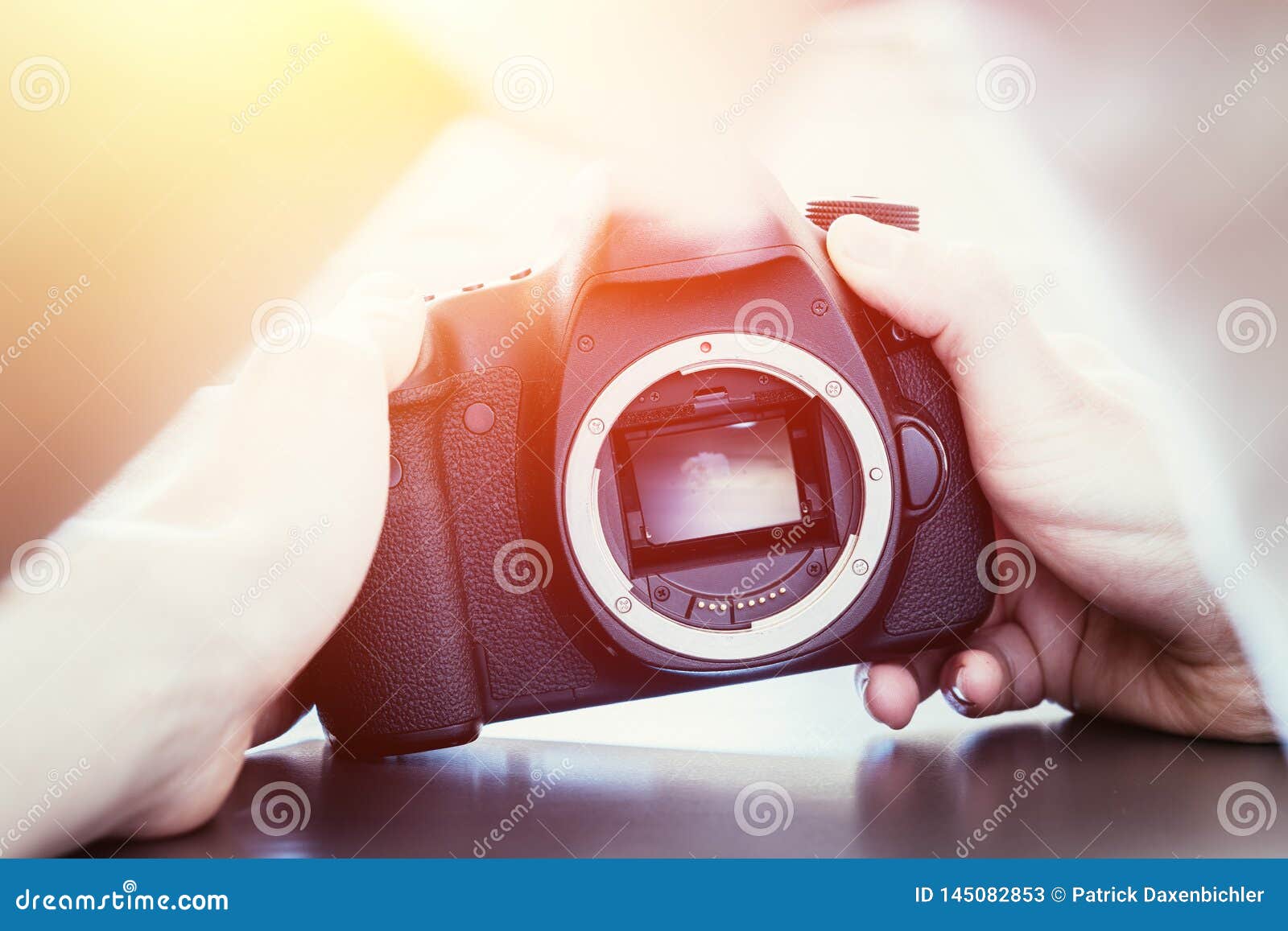 Photographer is Using a Professional Camera, Open Sensor and Sunlight ...