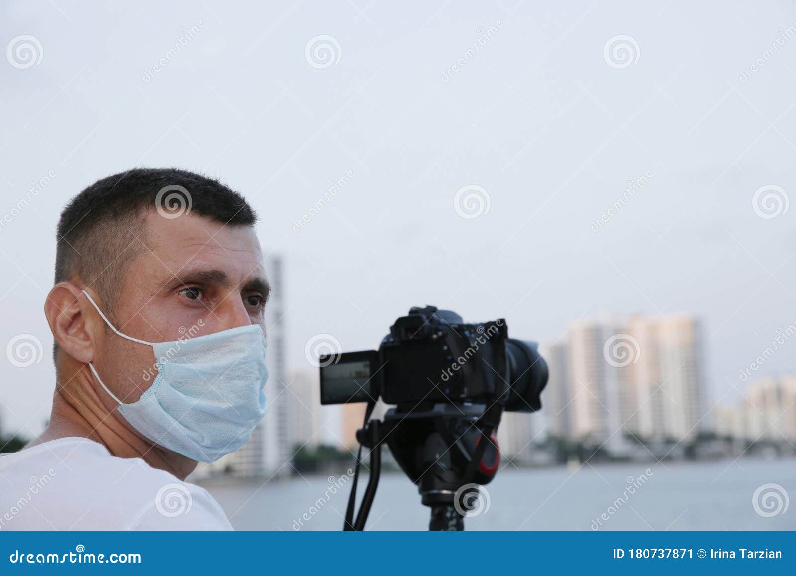 Photographer or Videographer in Action with a Digital Camera in a ...