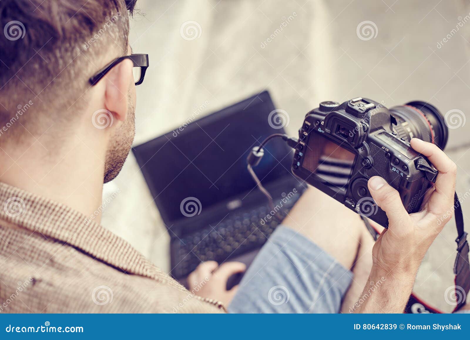 Photographer Viewing Photos on the Camera Stock Image - Image of ...