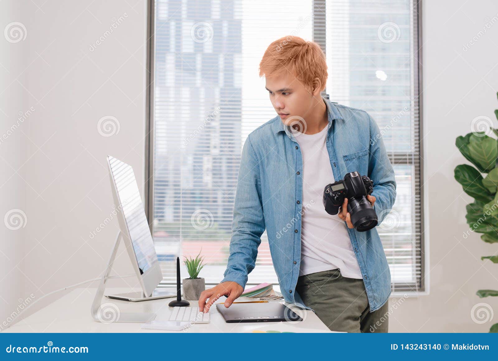 Photographer Working at Desk in Modern Office Stock Photo - Image of ...