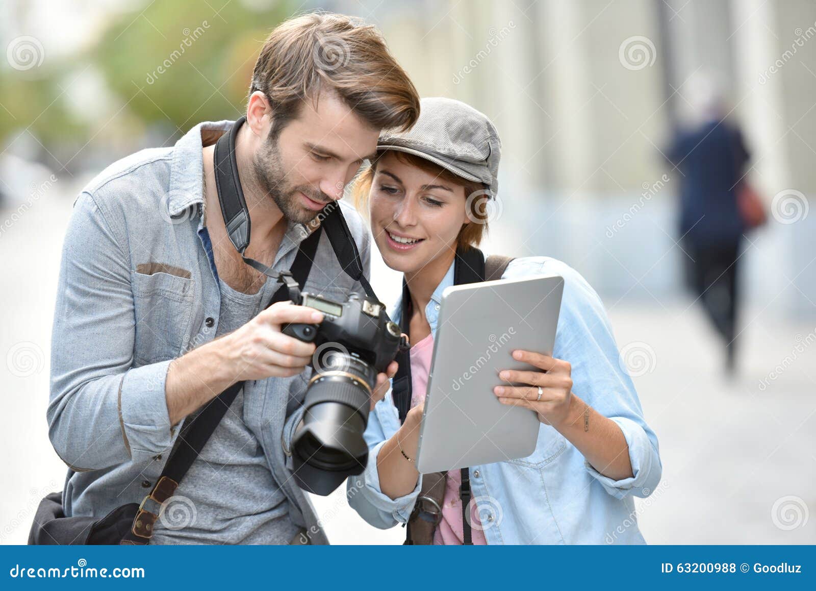 Photographers Checking Their Shots on Tablet Stock Photo - Image of ...