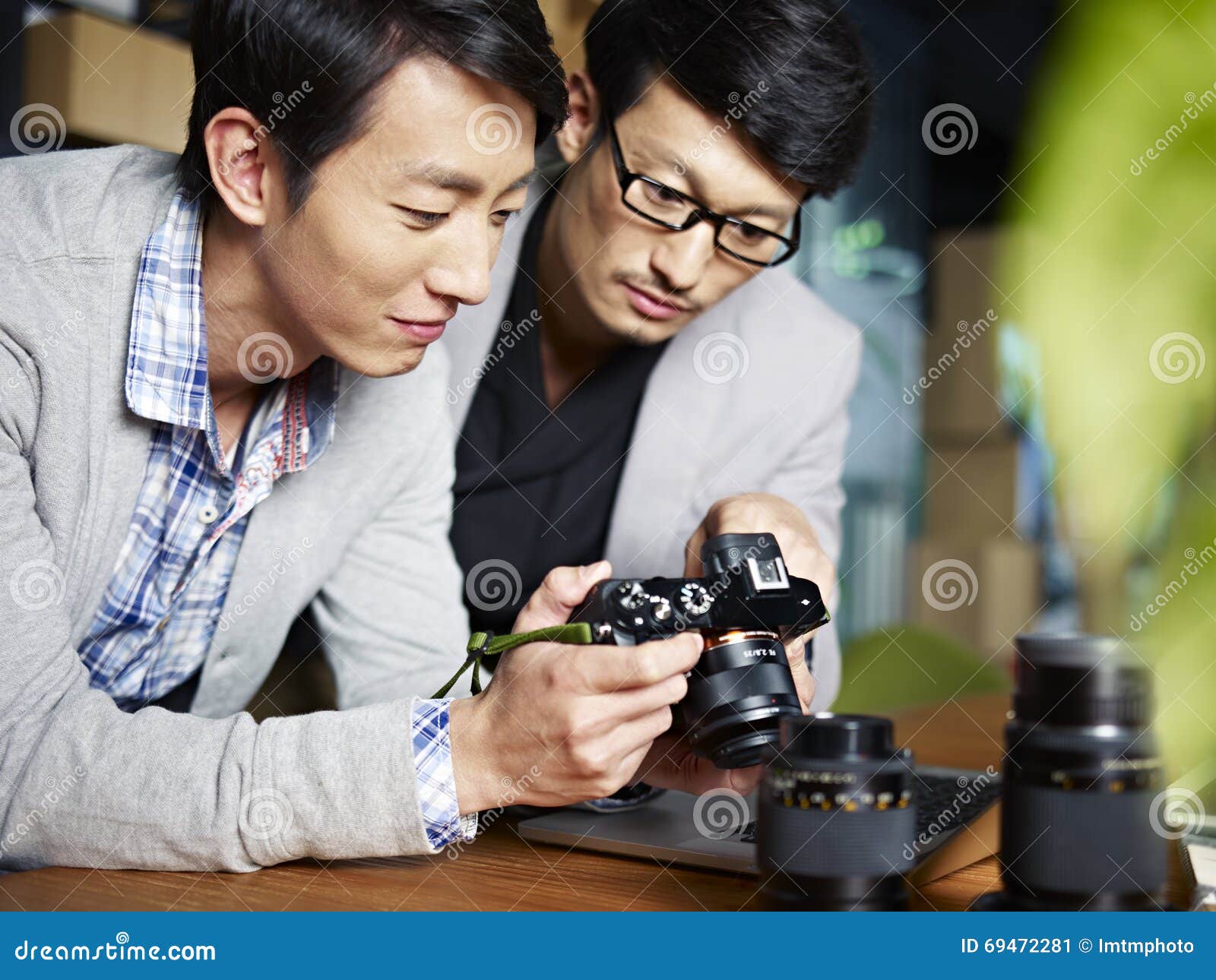 Photographers at work stock image. Image of coworkers - 69472281