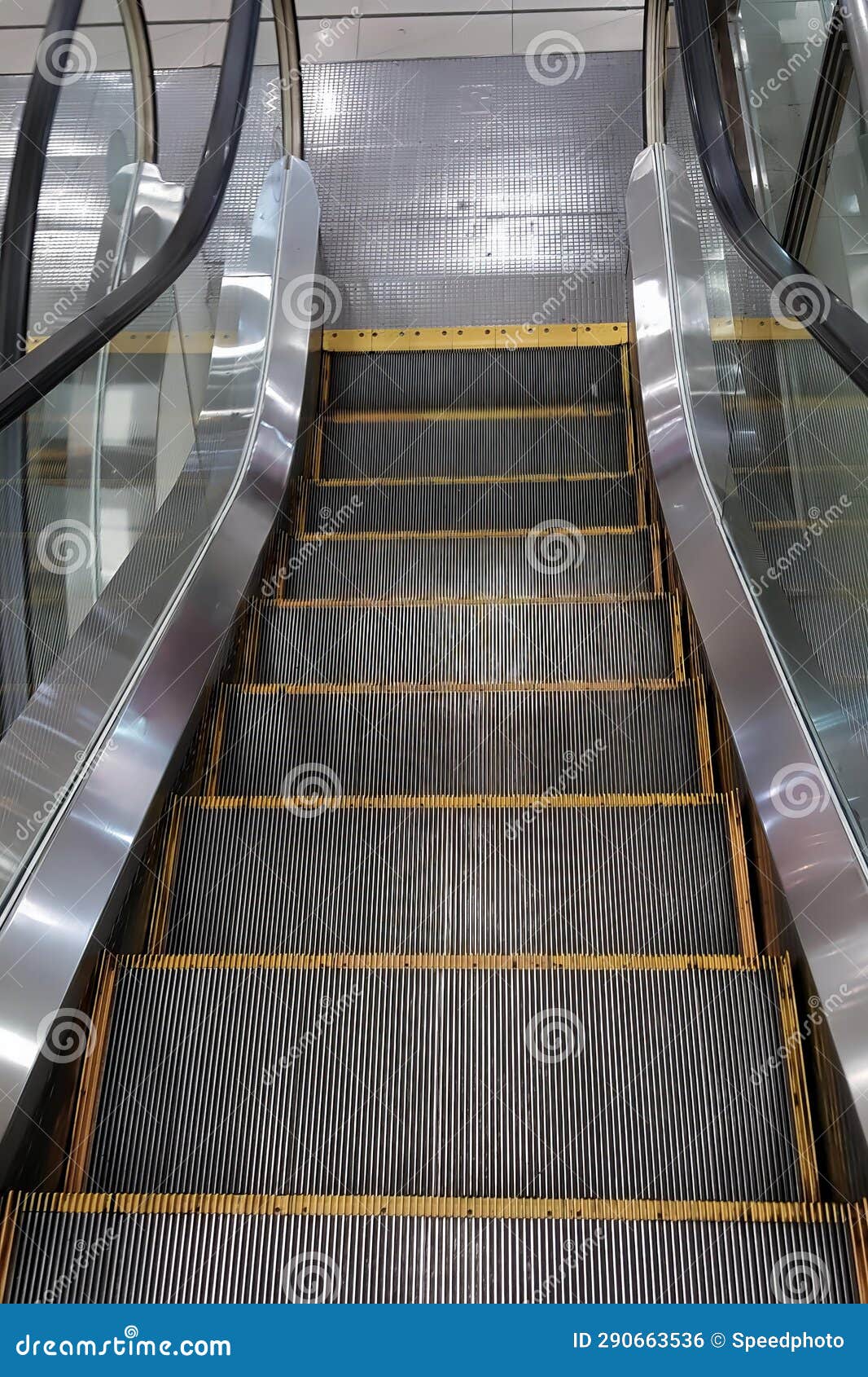 A Photography of an Escalator with a Metal Railing and a Metal Handrail ...