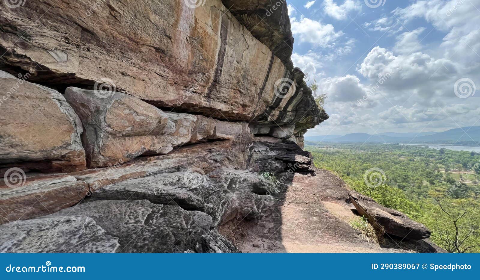 A Photography of a Rock Wall with a View of a Valley, Drop - Off of a ...