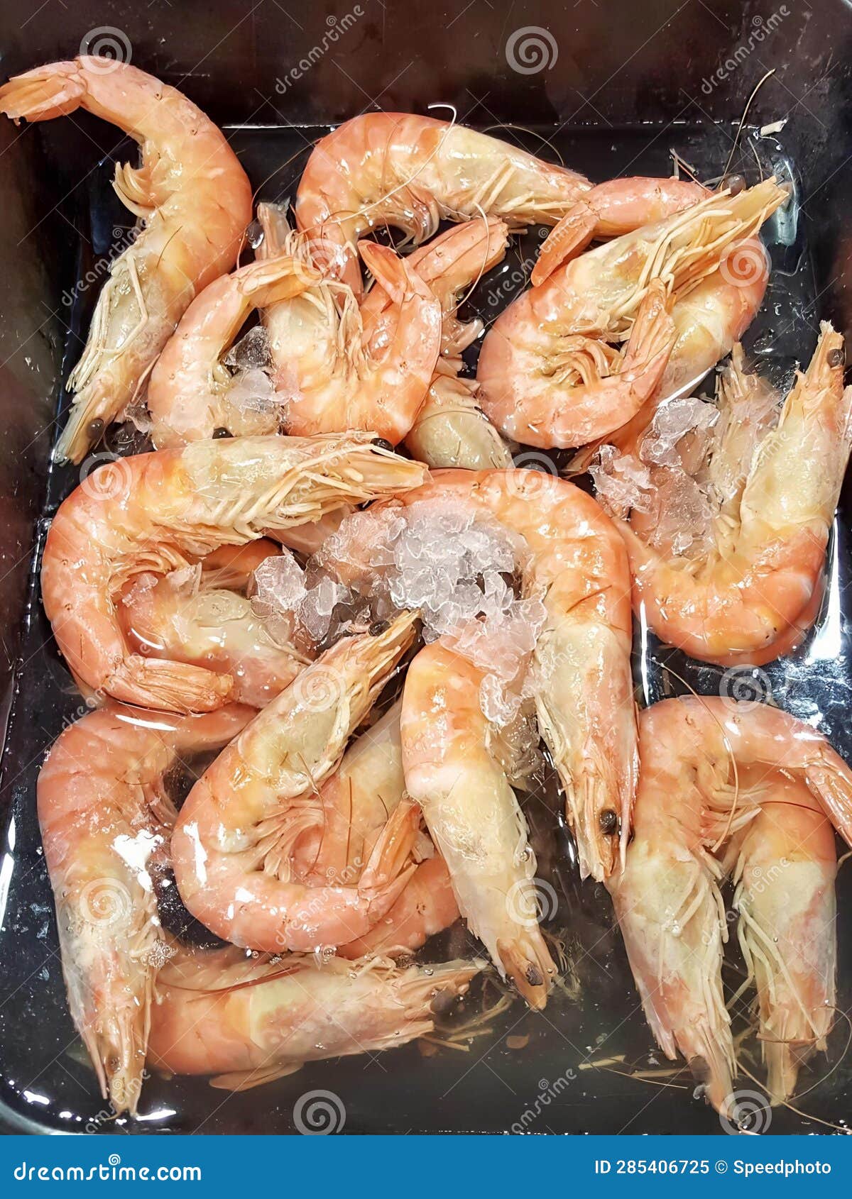 A Photography of a Tray of Shrimp Sitting on Top of a Table, There are ...