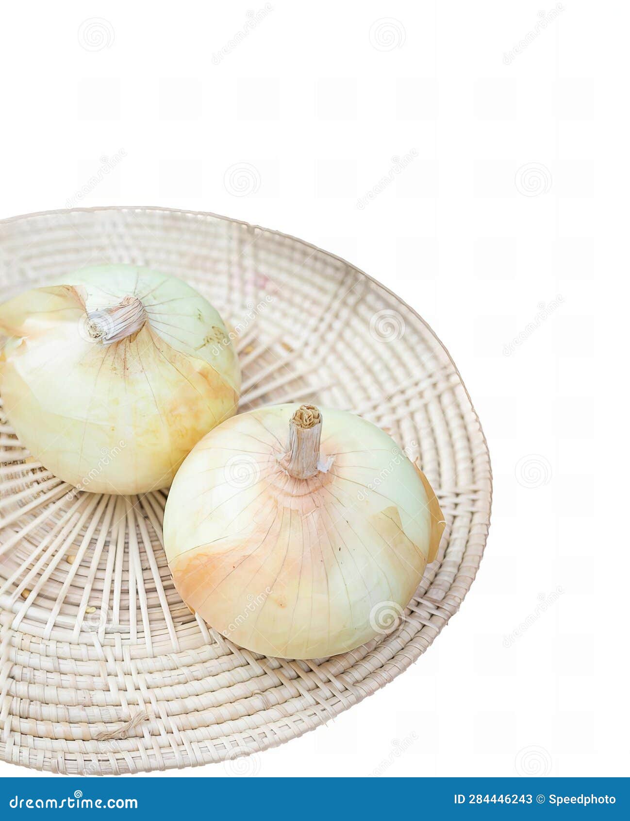 A Photography of Two Onions on a Wicker Plate on a White Background ...