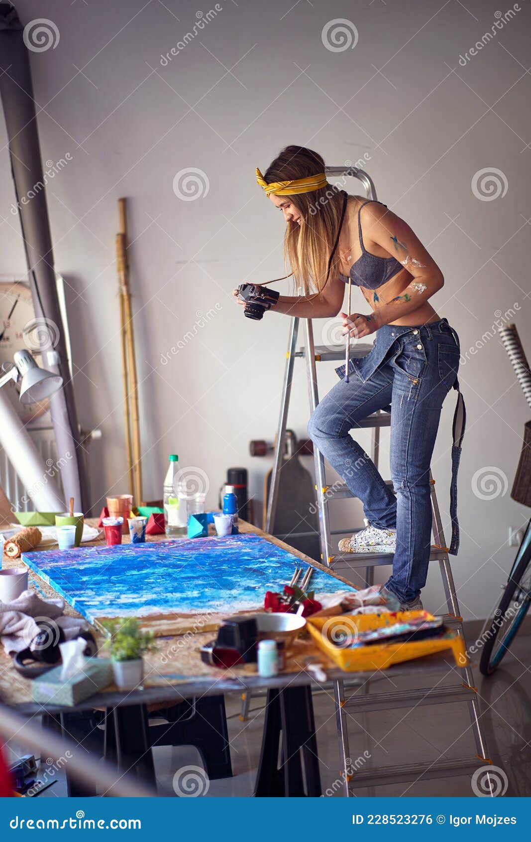 Photos of Art. Female Artist Using Camera in Art Studio Stock Photo ...
