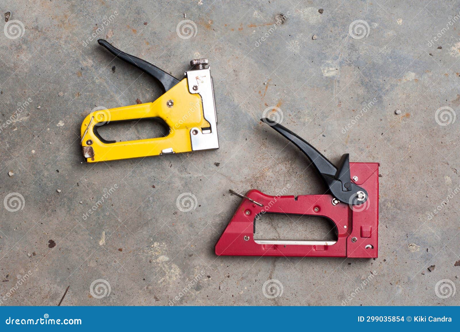 Red and yellow stapler gun stock photo. Image of machine - 299035854