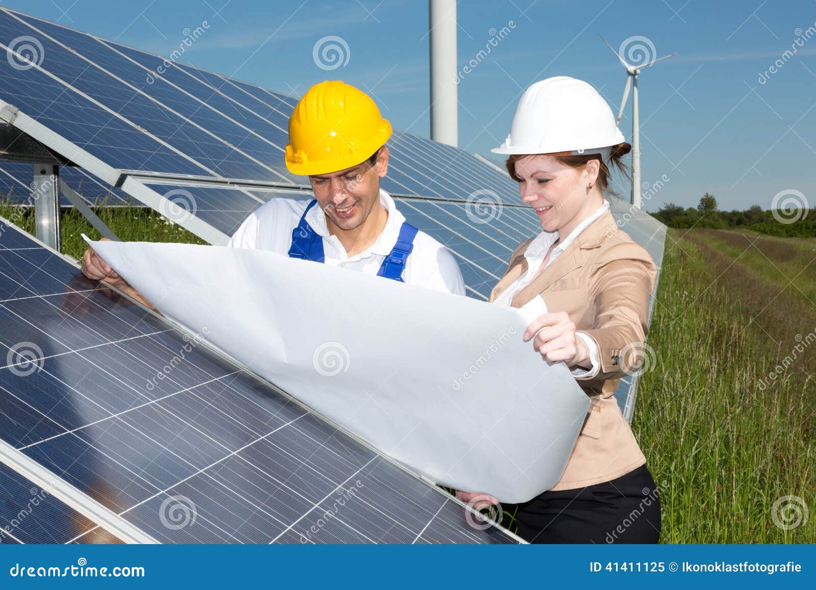 Photovoltaic Engineers with Construction Plan at Solar Panels Stock ...