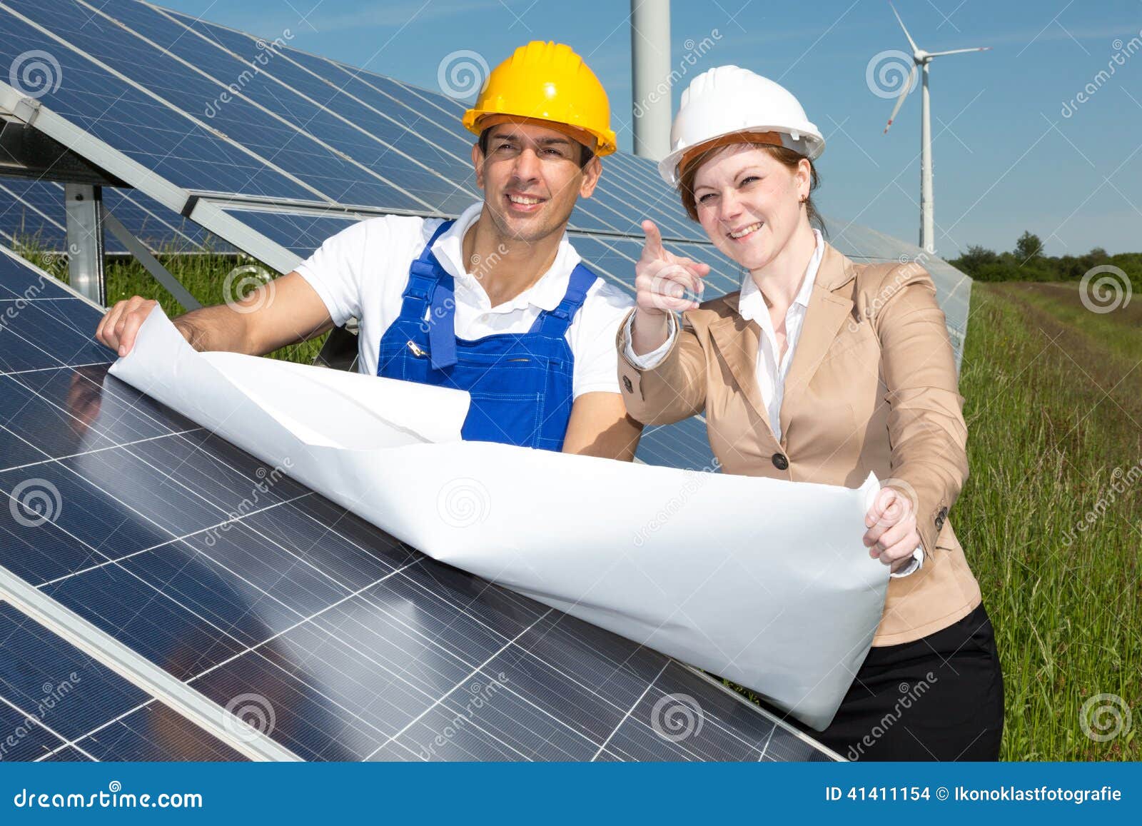 Photovoltaic Engineers with Construction Plan at Solar Panels Stock ...