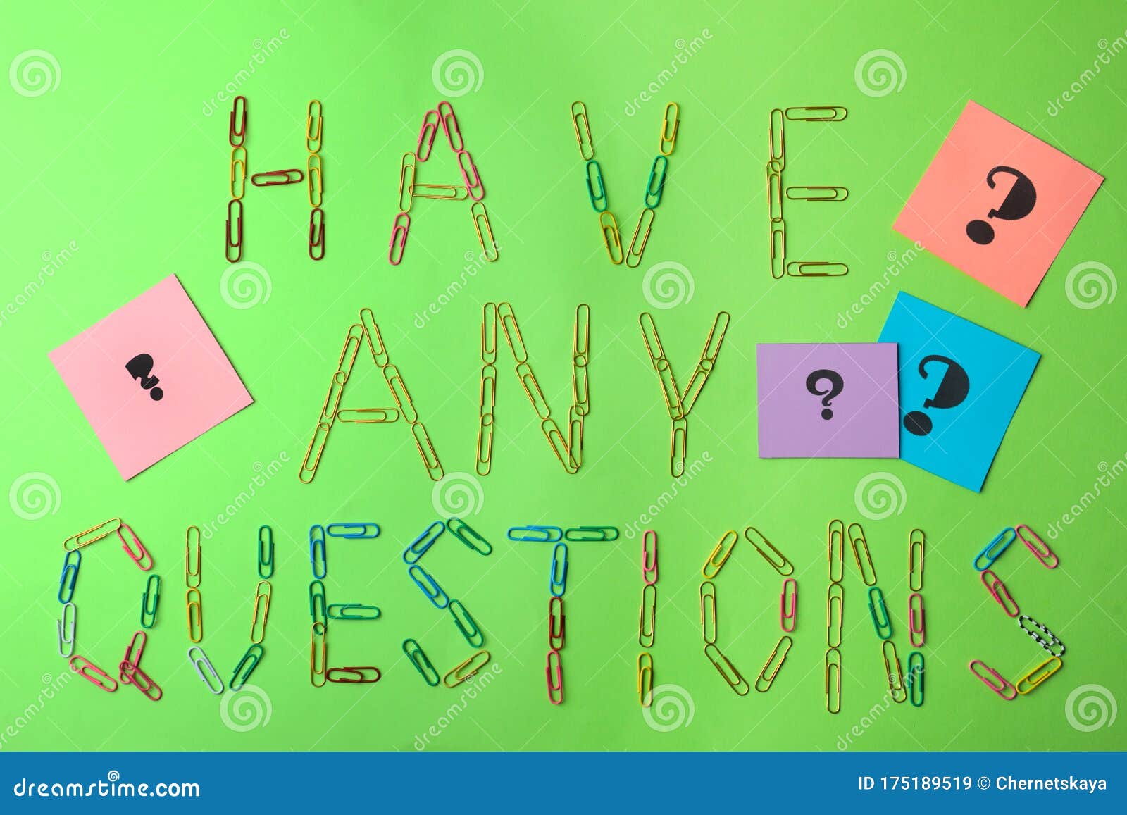 Phrase HAVE ANY QUESTIONS with Paperclips and Query Marks on Green ...