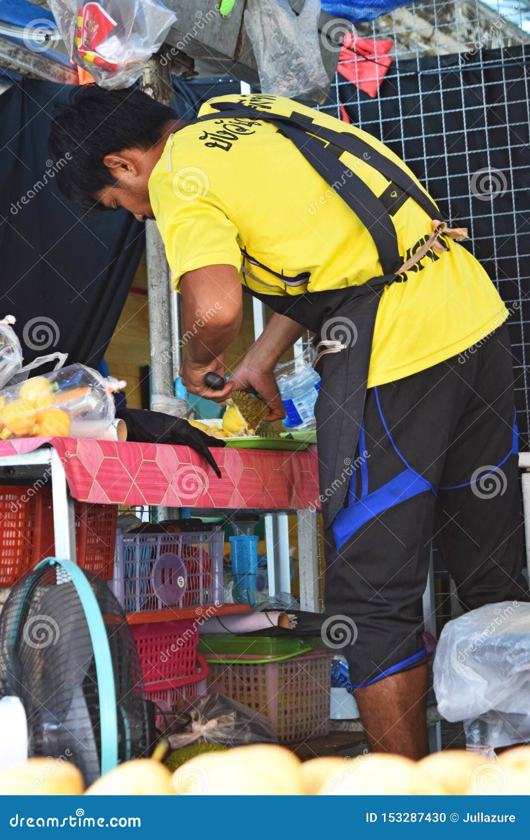 Phuket, Thailand - March 15, 2016: a Man Cuts Open a Durian with a ...