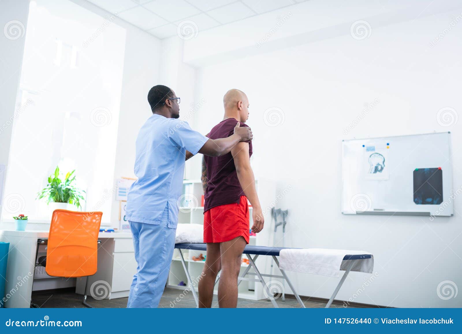 Bodybuilder in Red Shorts Having Physical Examination after Training ...