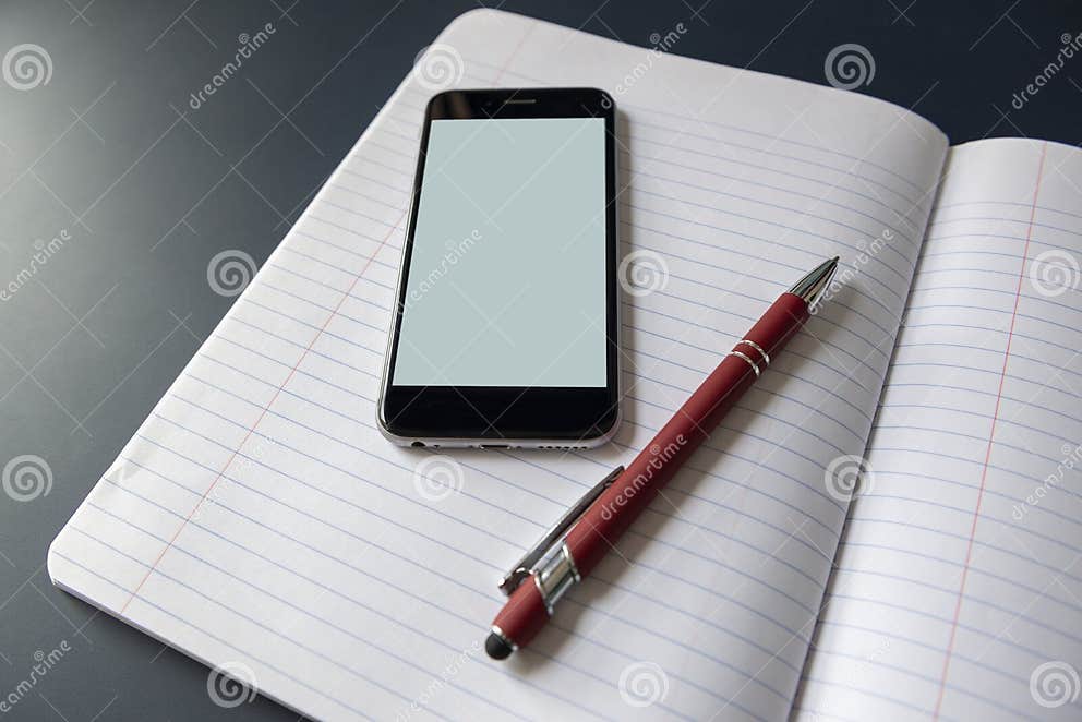 A Physical Notepad with a Pen and a Smart Phone Stock Image - Image of ...