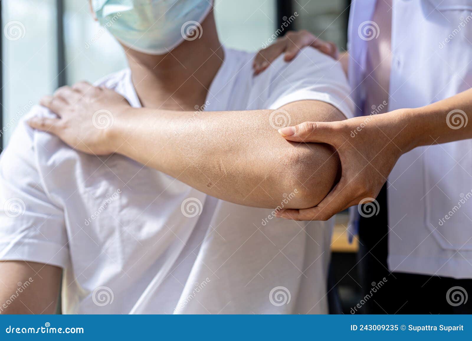 A Physical Therapist is Doing Physical Therapy on a Patient, the ...