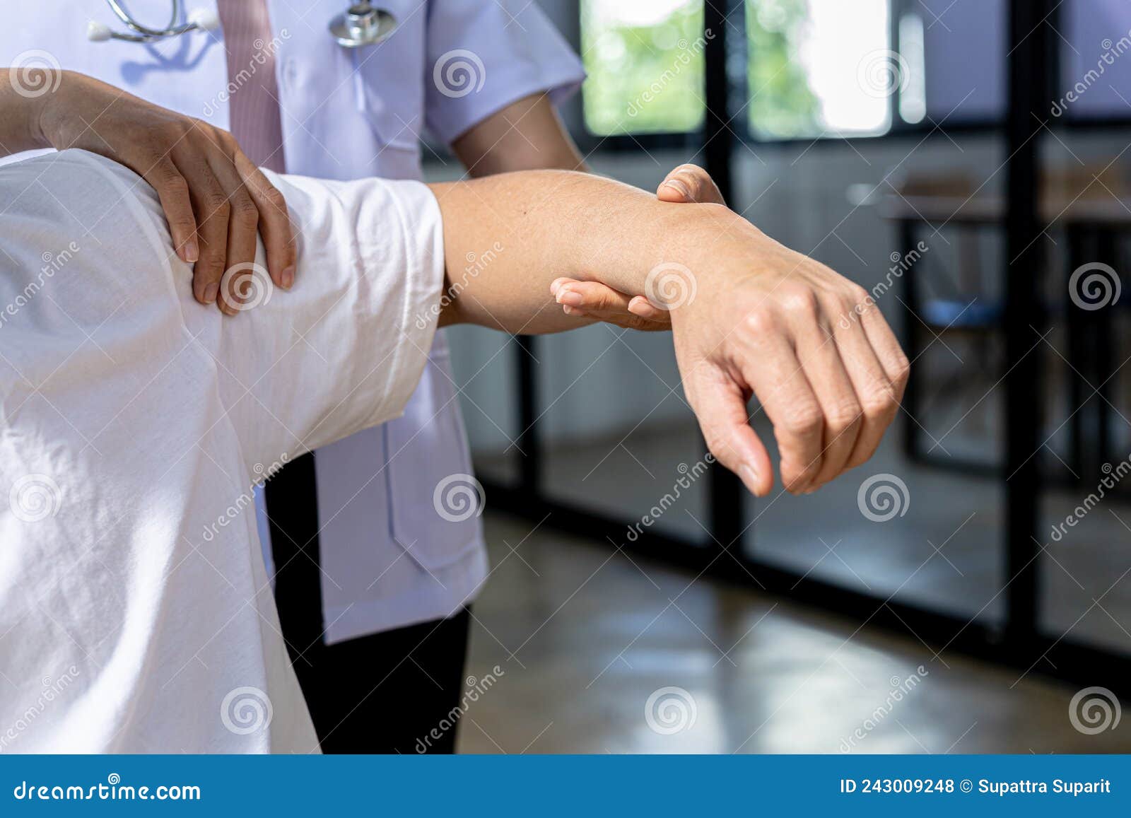 A Physical Therapist is Doing Physical Therapy on a Patient, the ...