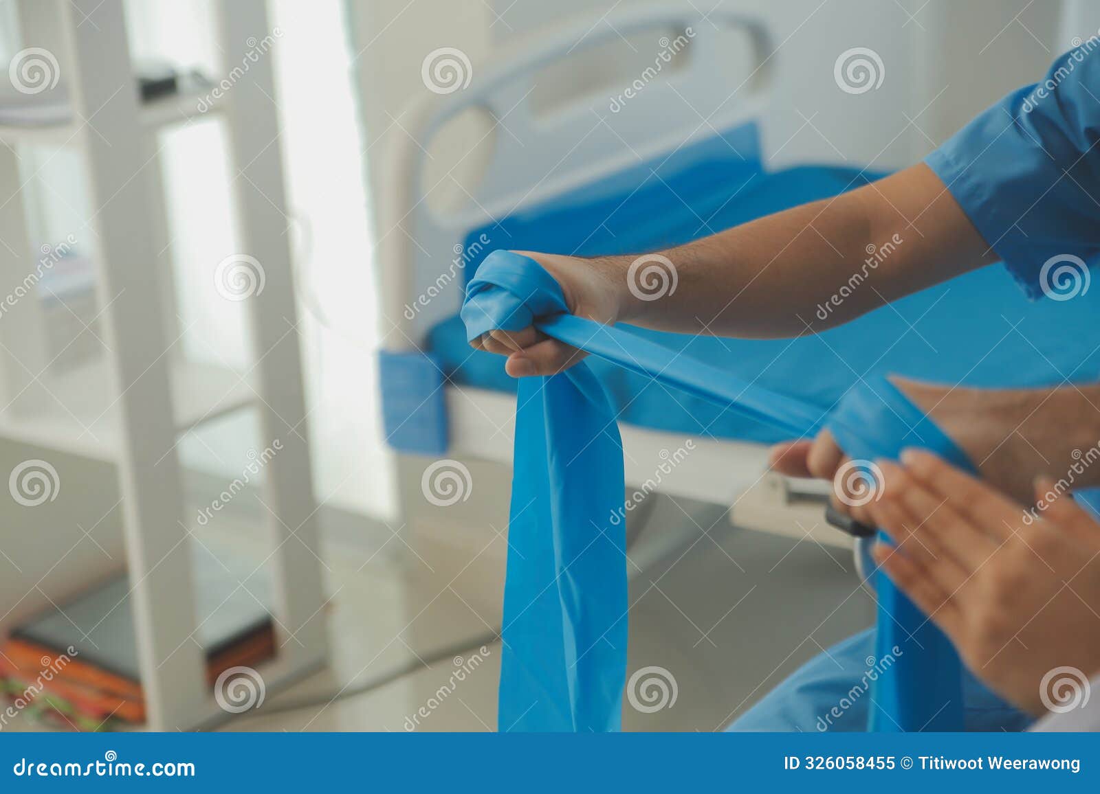 Physical Therapist Guiding Patient with Resistance Band Stock Image ...