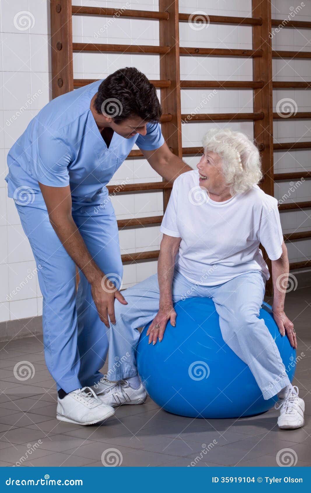Physical Therapist Helping a Patient Stock Photo - Image of male ...