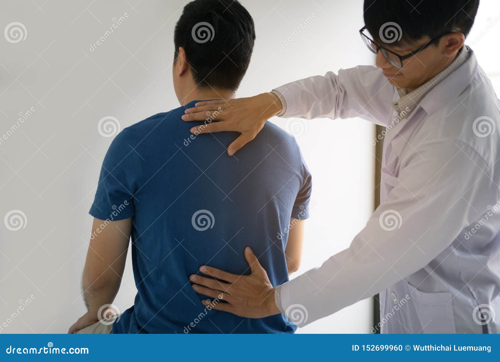 Physical Therapists are Using Hands To Check the Back of the Patient ...