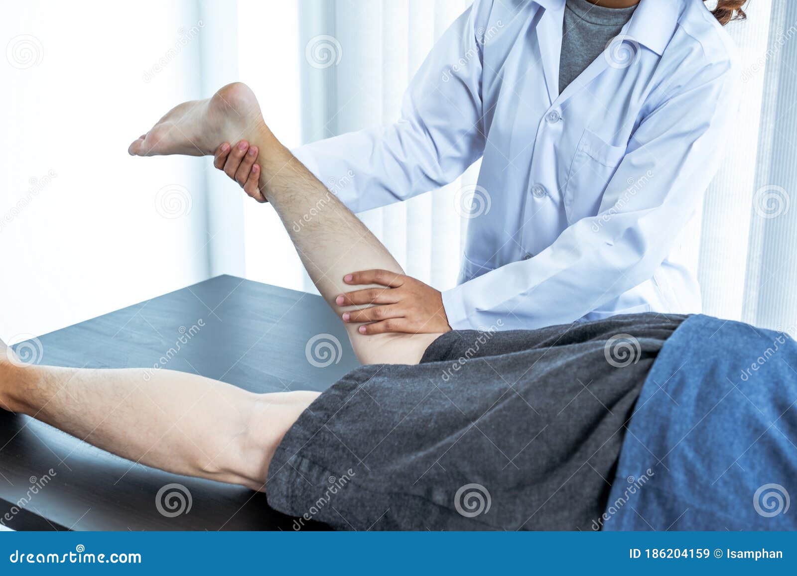 Physical Therapy Stretching Patients Leg in the Hospital Stock Image ...