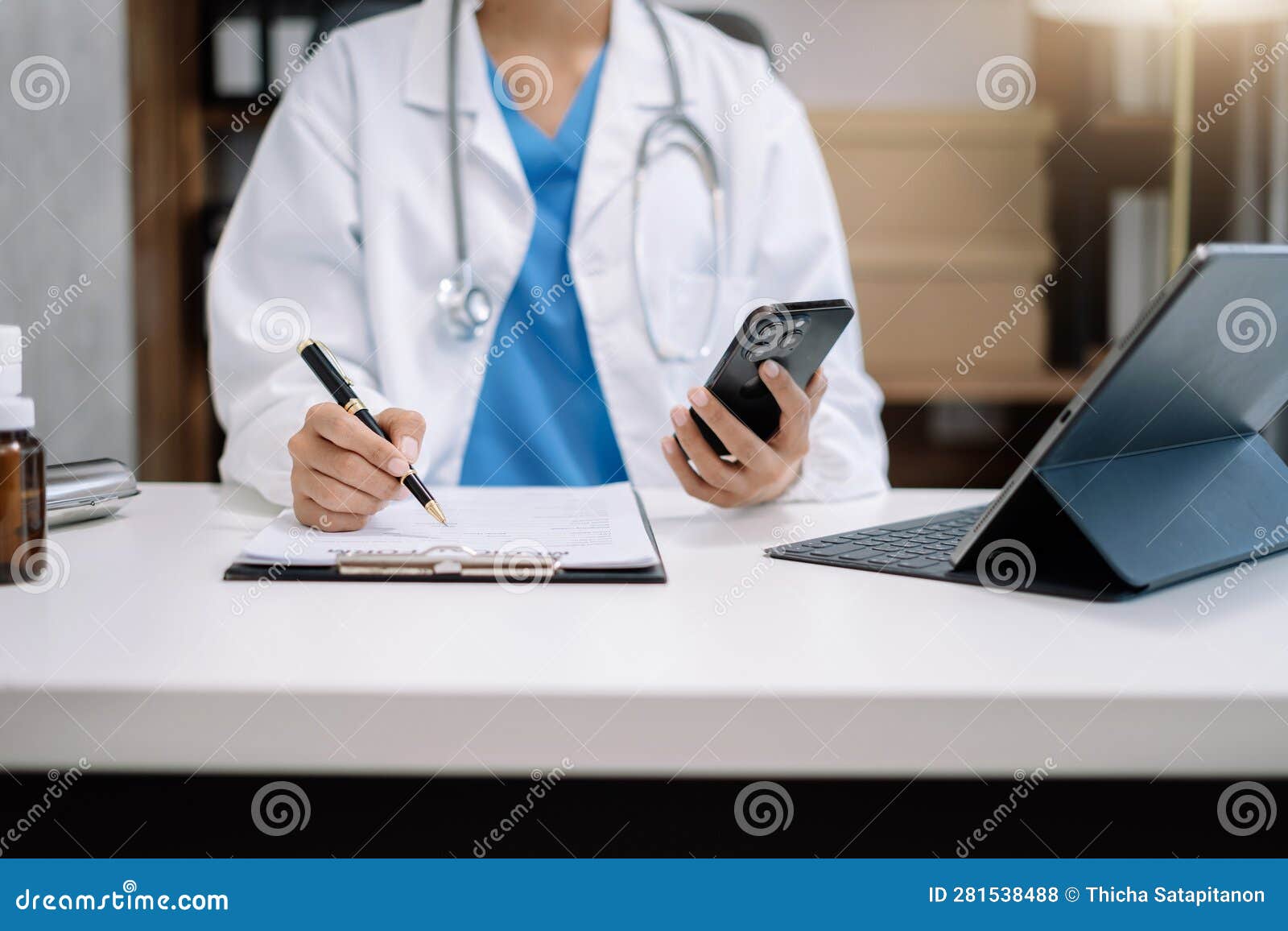 Physician or Practitioner in Room Writing on Blank Notebook and Work on ...