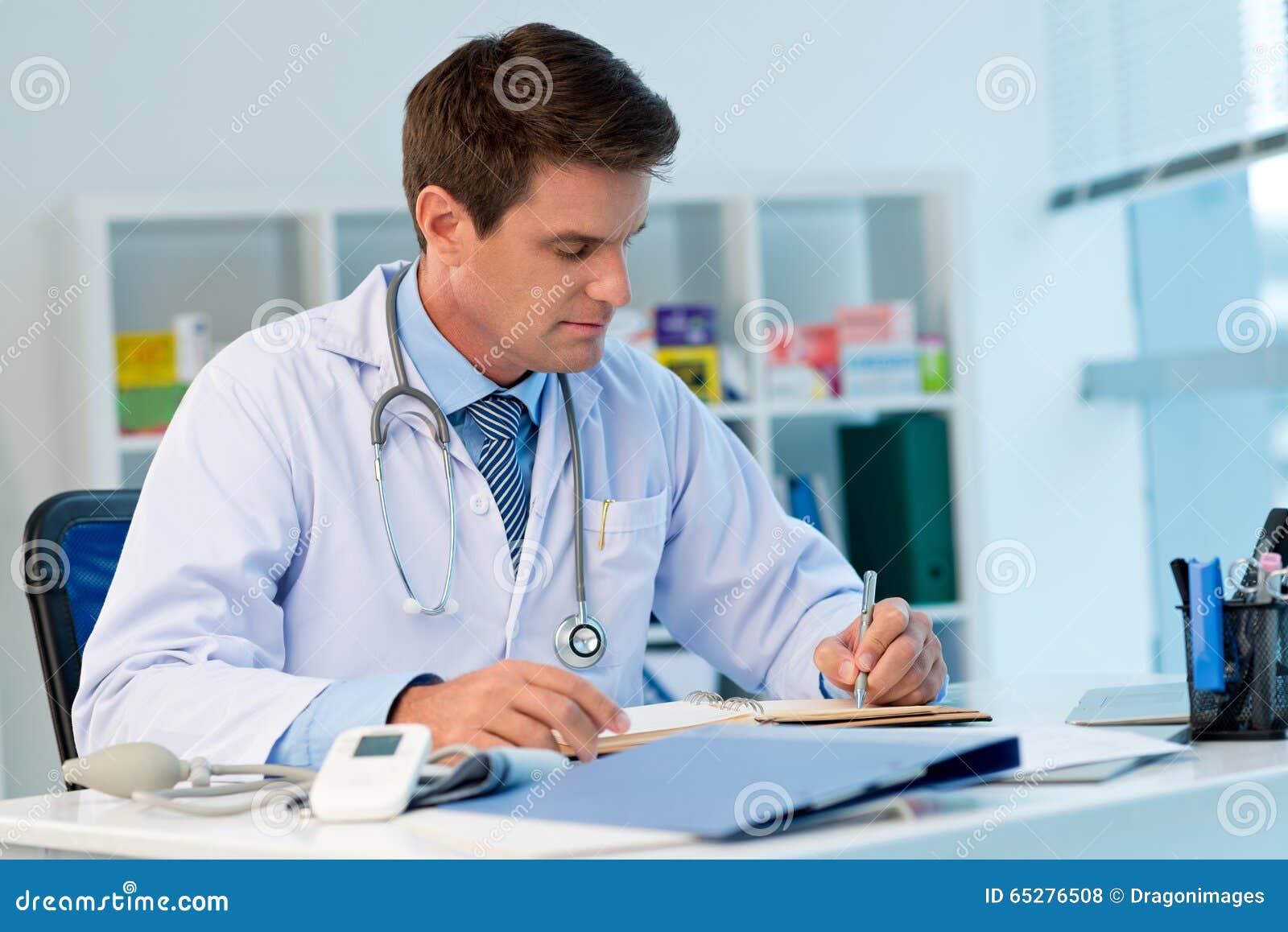 Physician at work stock photo. Image of serious, doctor - 65276508