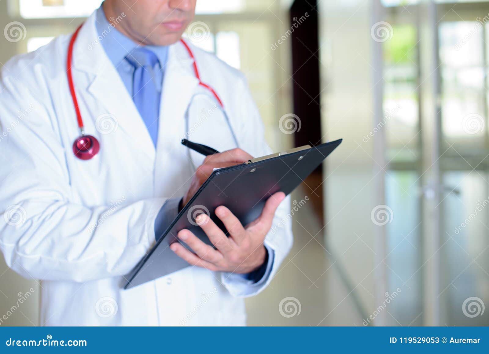 Physician writing a report stock image. Image of information - 119529053