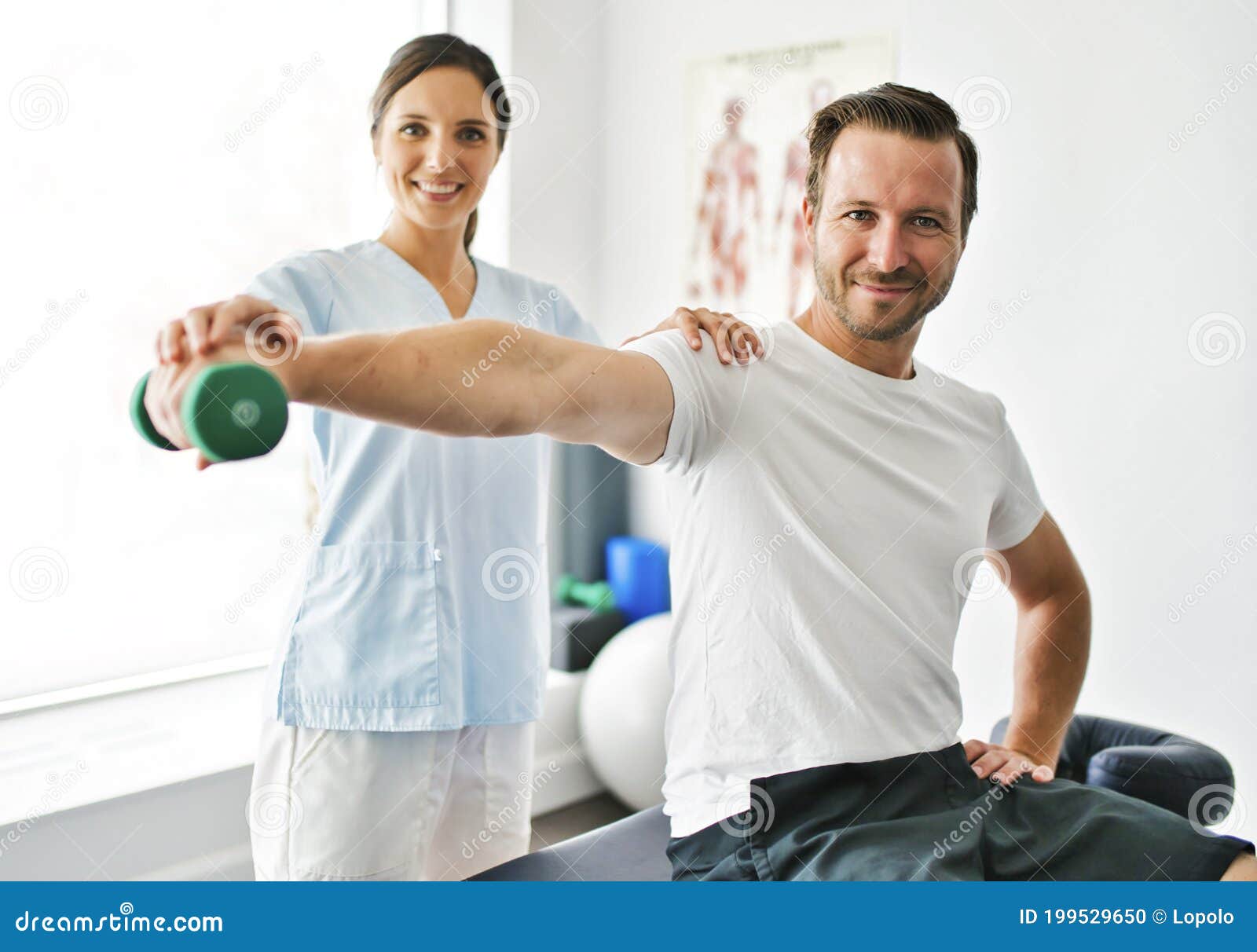 Physiotherapist Doing Treatment with Patient in Bright Office Stock ...