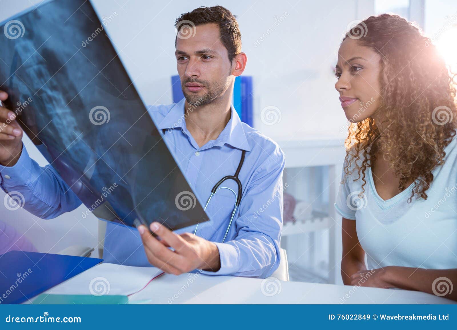 Physiotherapist Explaining X-ray To Patient Stock Image - Image of ...