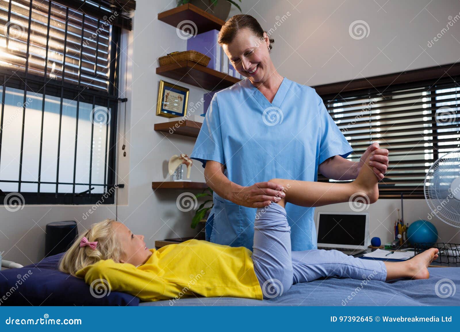 Physiotherapist Giving Physical Therapy To The Girl Stock Image Image
