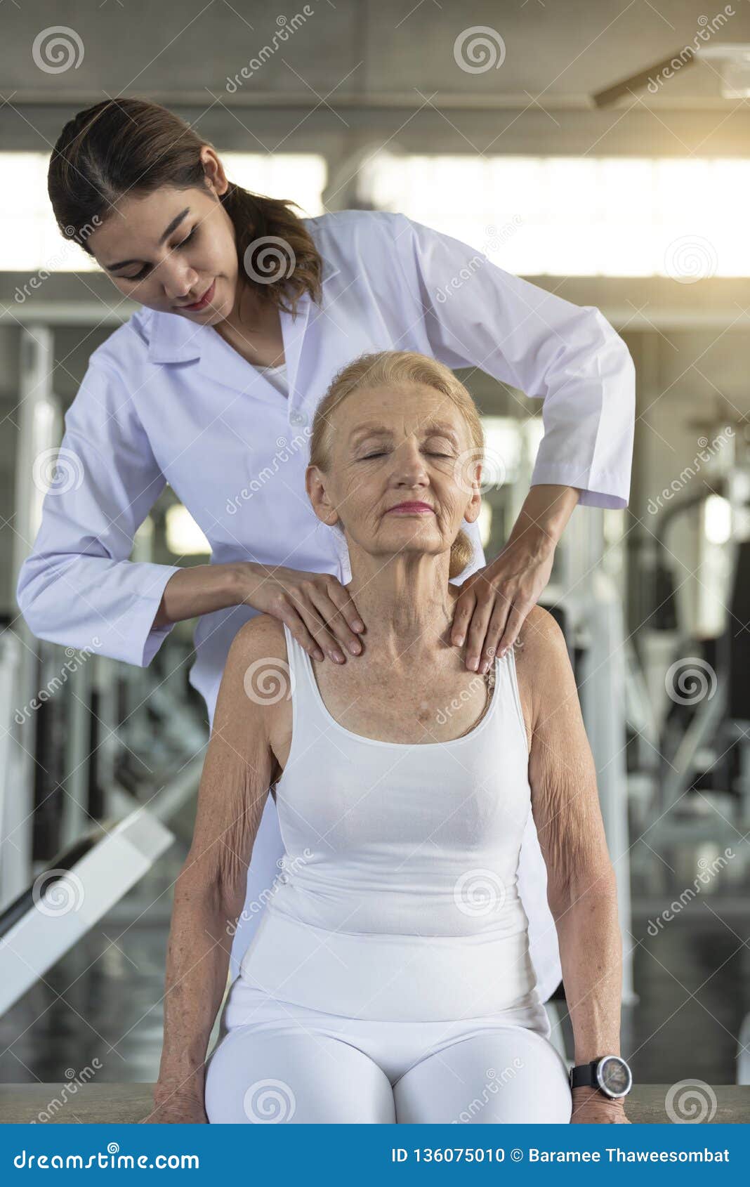 Physiotherapist Helping Old Senior Woman In Physical Center Elderly
