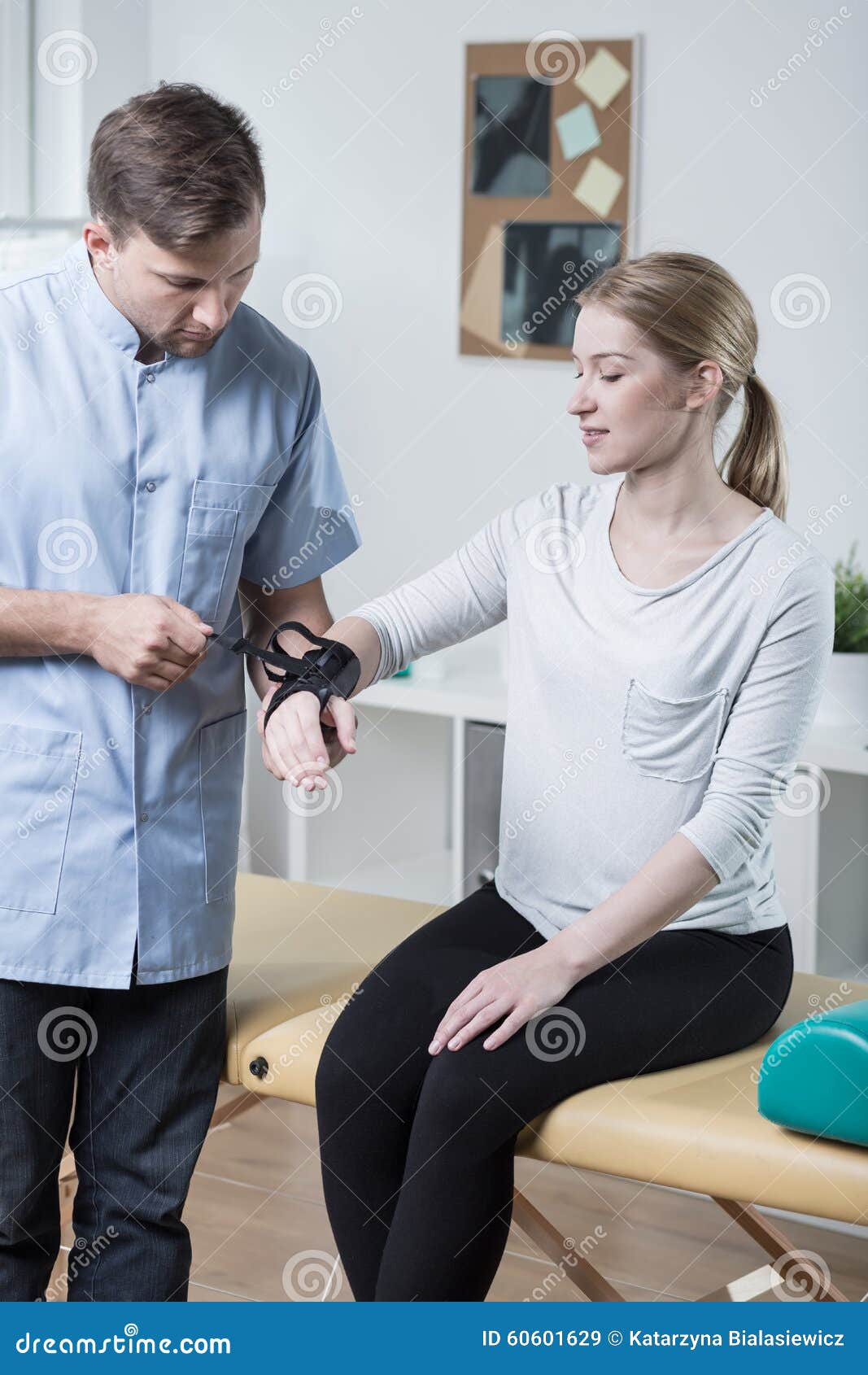 Physiotherapist Putting Orthosis on Hand Stock Image - Image of ...