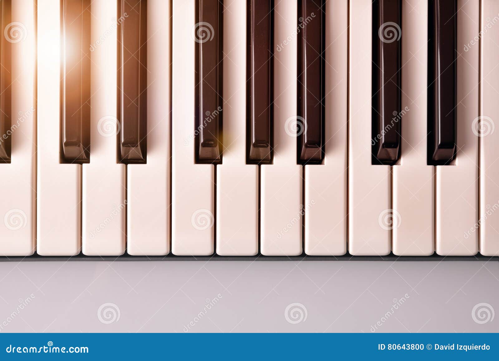 Piano Keyboard with Golden Shine Top View Stock Photo - Image of close ...