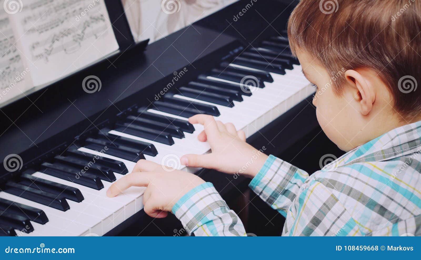 Piano Keys. Boy Receives Piano Lessons Stock Photo - Image of musical ...