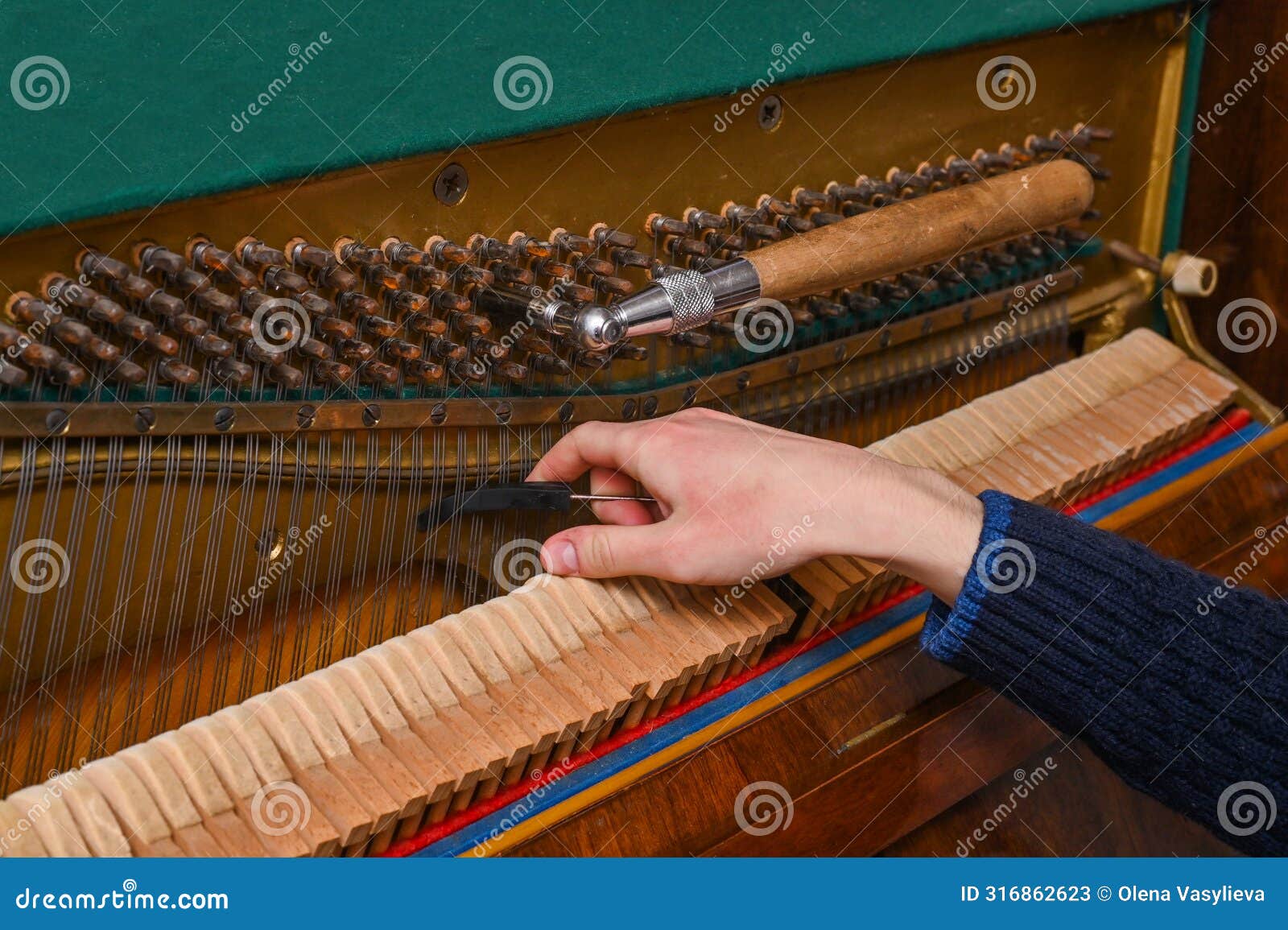 The Piano Tuner& X27;s Hand and Instrument. Close-up Stock Image ...
