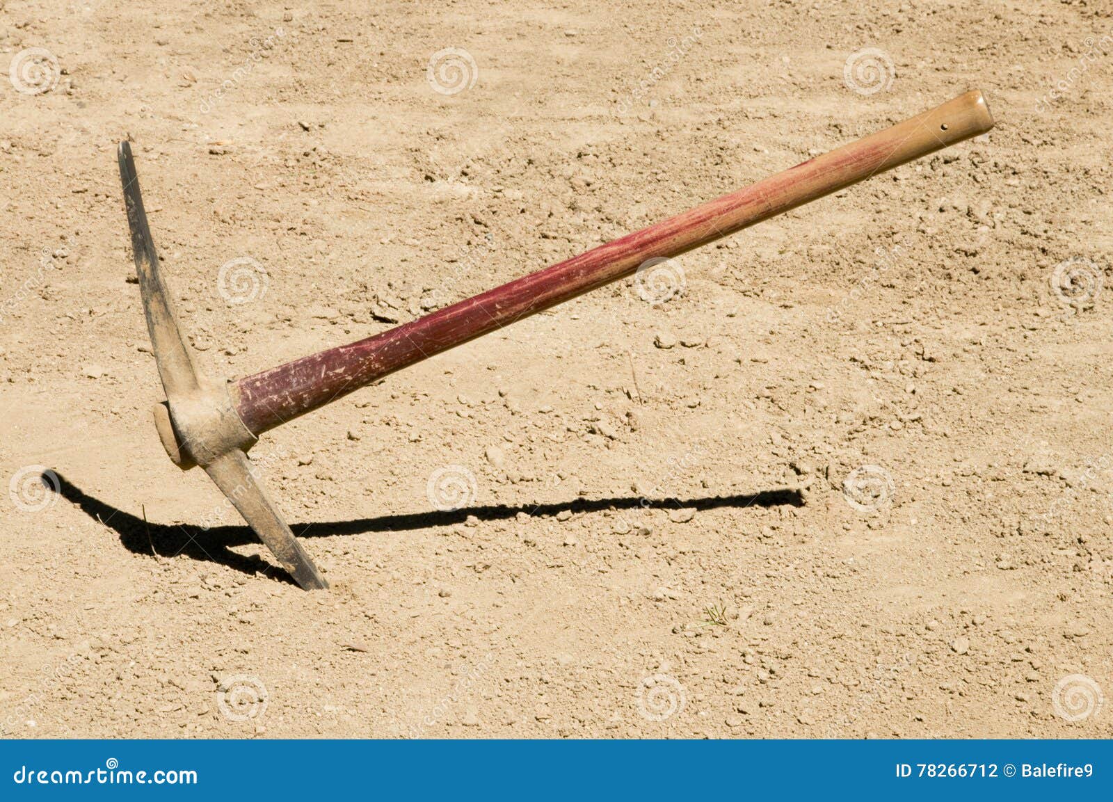 Pick Ax Plunged into Dirt Ground Stock Photo - Image of tool, ground ...