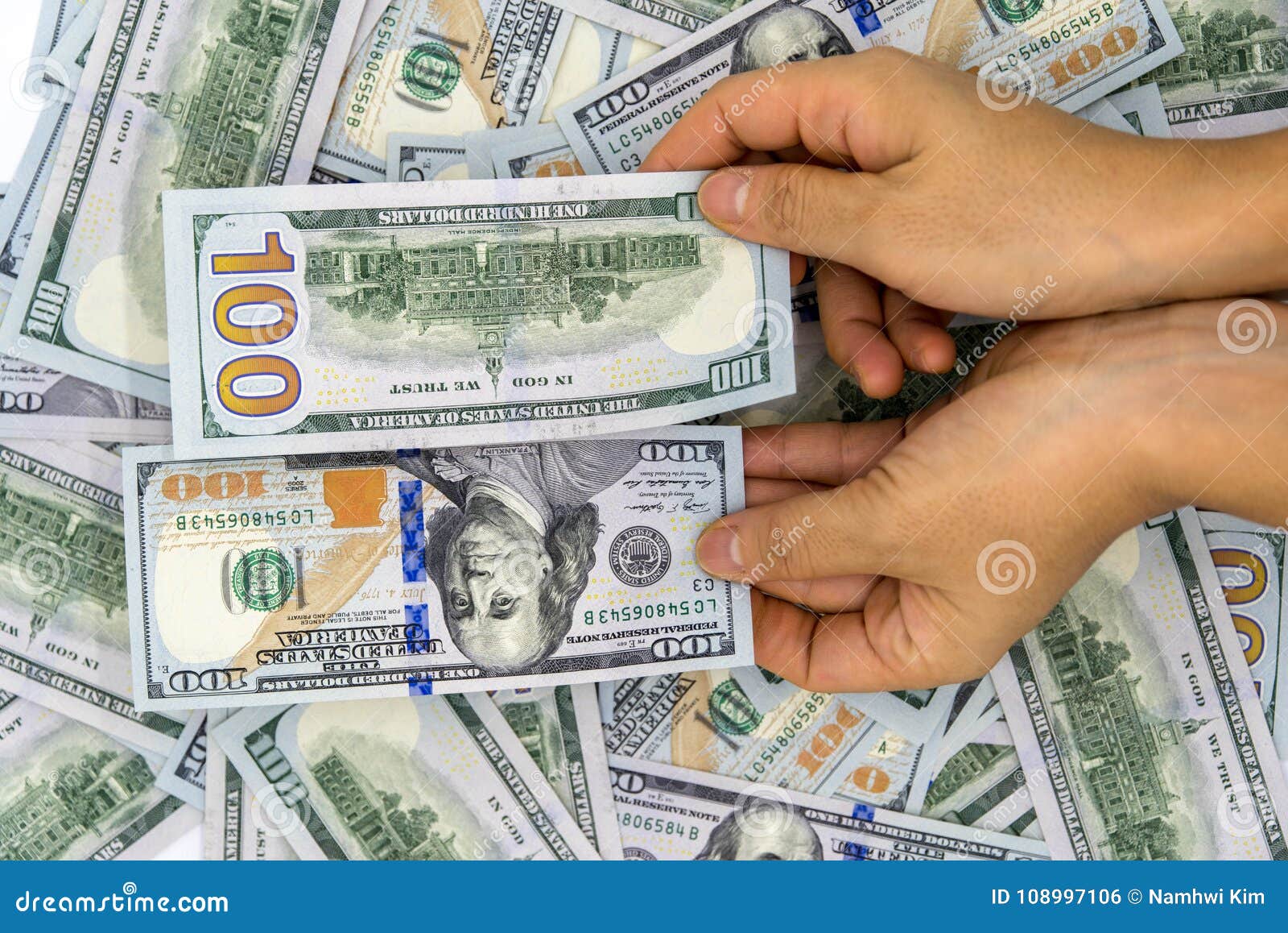 Pick up 100 us dollar stock photo. Image of concept - 108997106