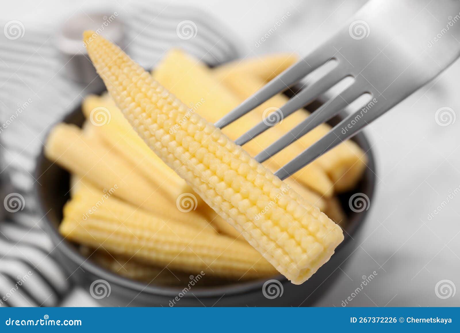 Pickled Baby Corn on Fork at Table, Closeup Stock Photo - Image of ...