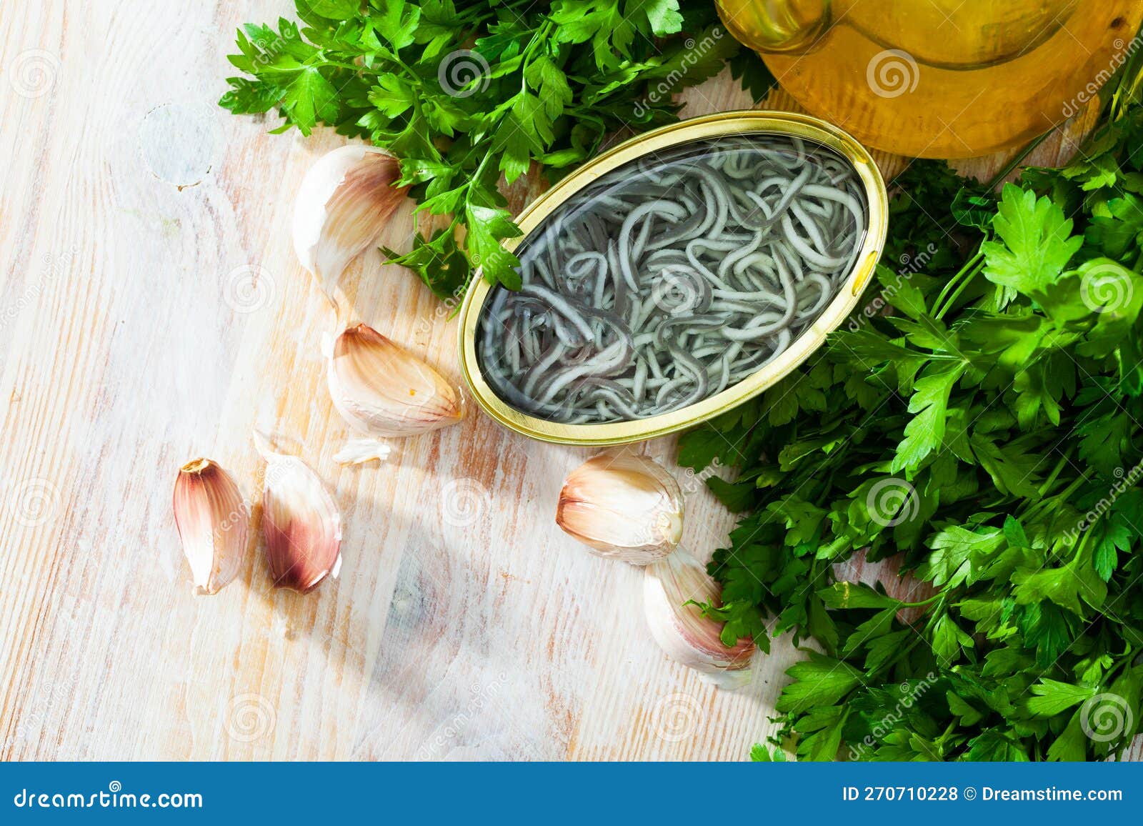 Pickled Eels in Open Tin Can with Garlic at Table Stock Photo - Image ...