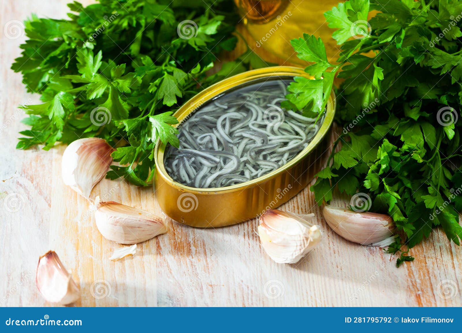Pickled Eels in Open Tin Can with Garlic at Table Stock Photo - Image ...