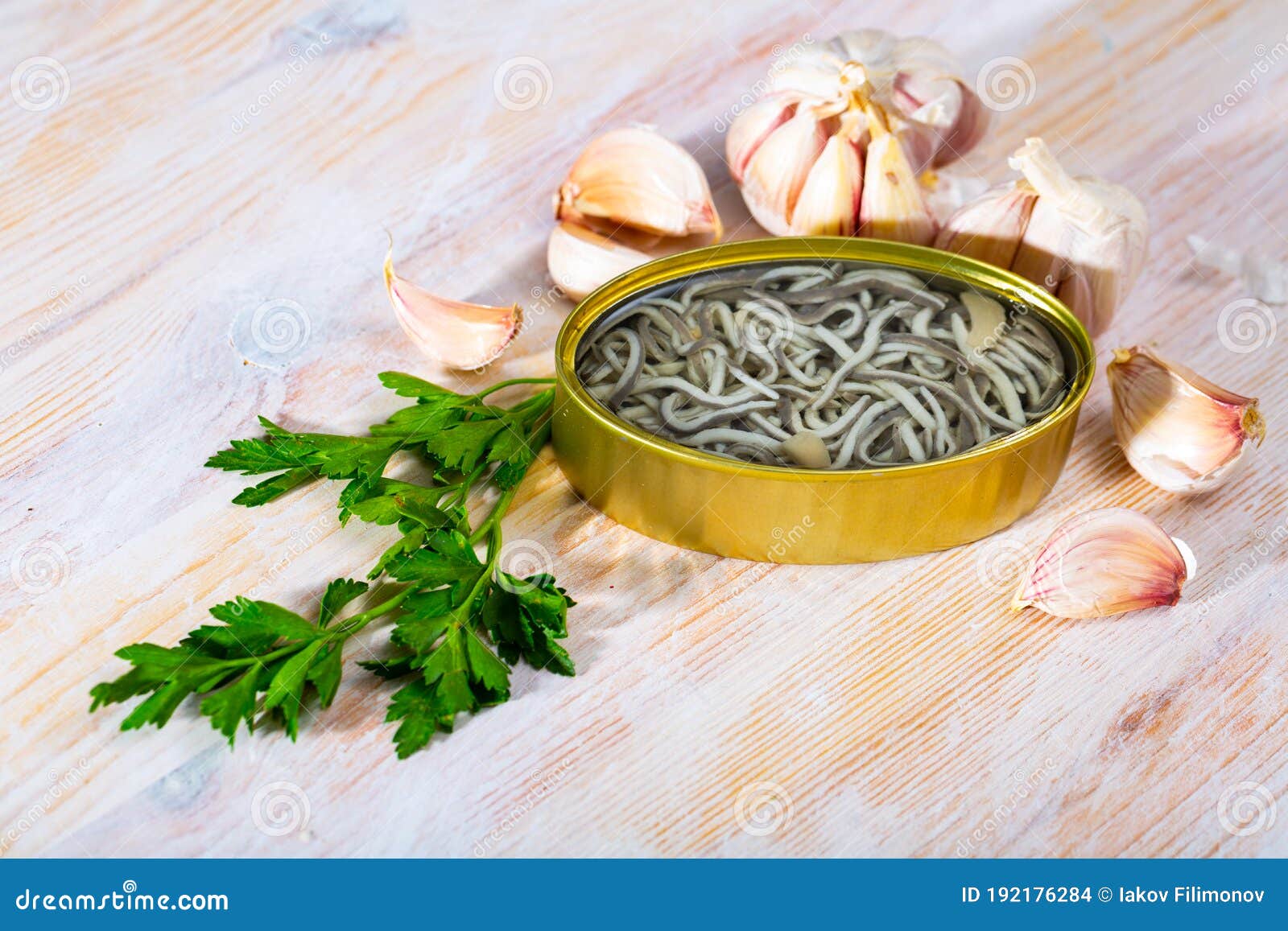 Pickled Eels in Open Tin Can with Garlic at Table, Nobody Stock Photo ...