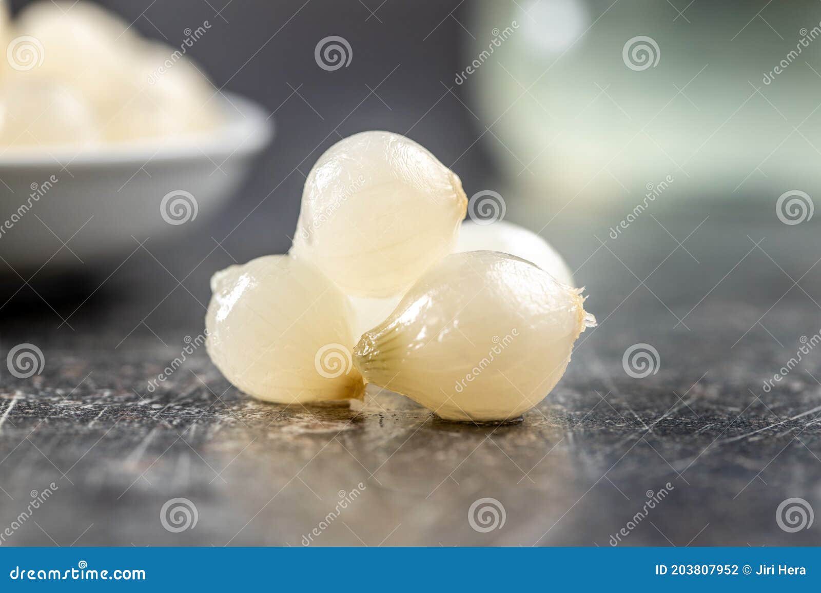 Pickled Mini Baby Onions on Black Kitchen Table Stock Photo - Image of ...