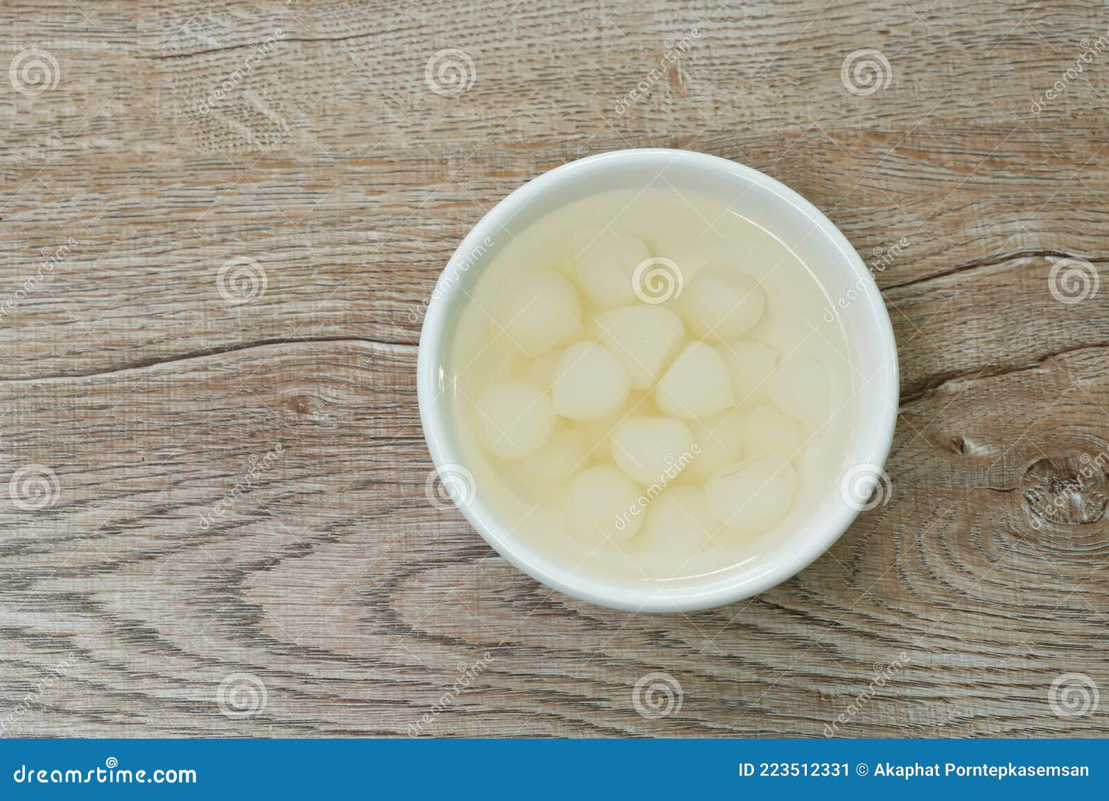 Pickled Single Garlic with Salt Water in Cup on Table Stock Image ...
