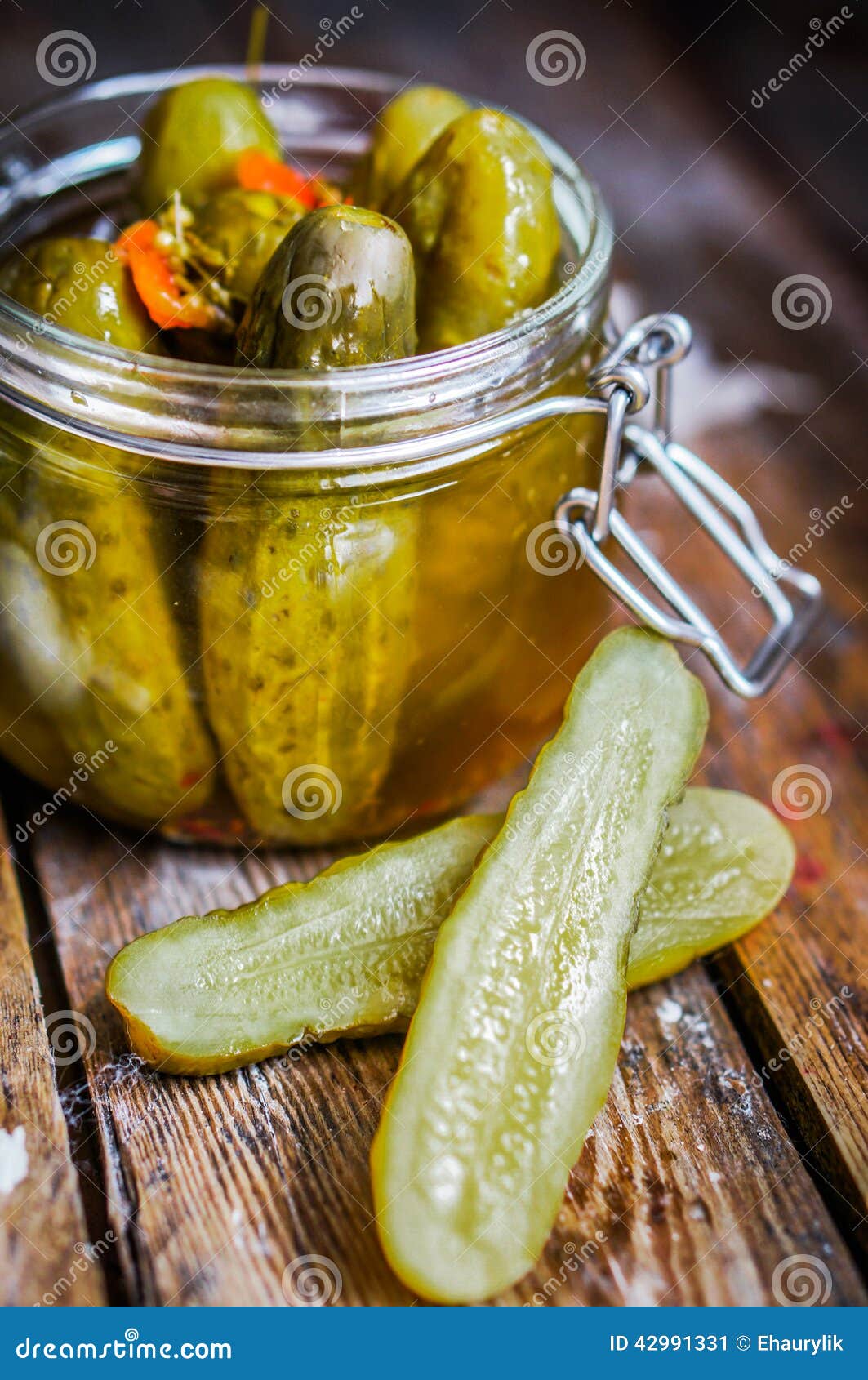 Pickles with Garlic in Glass Jar on Rustic Wooden Background Stock ...
