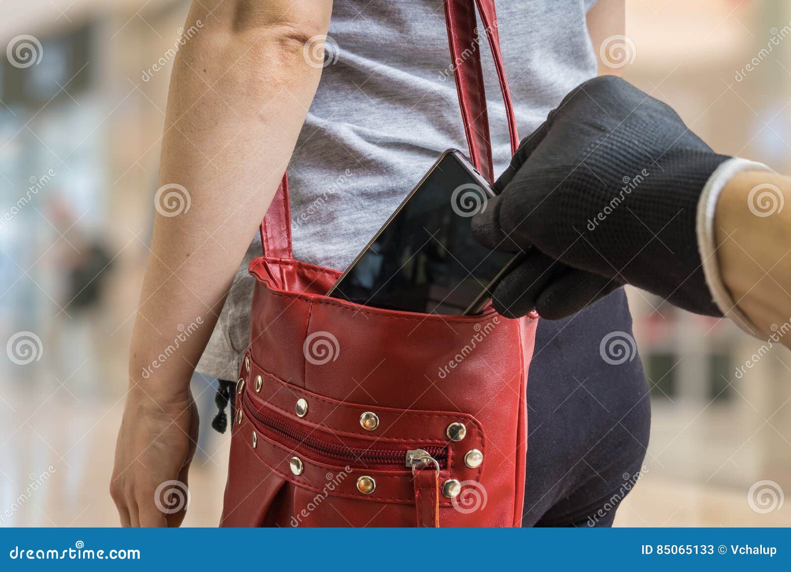 Pickpocket Thief is Stealing Smartphone from Red Handbag Stock Image ...