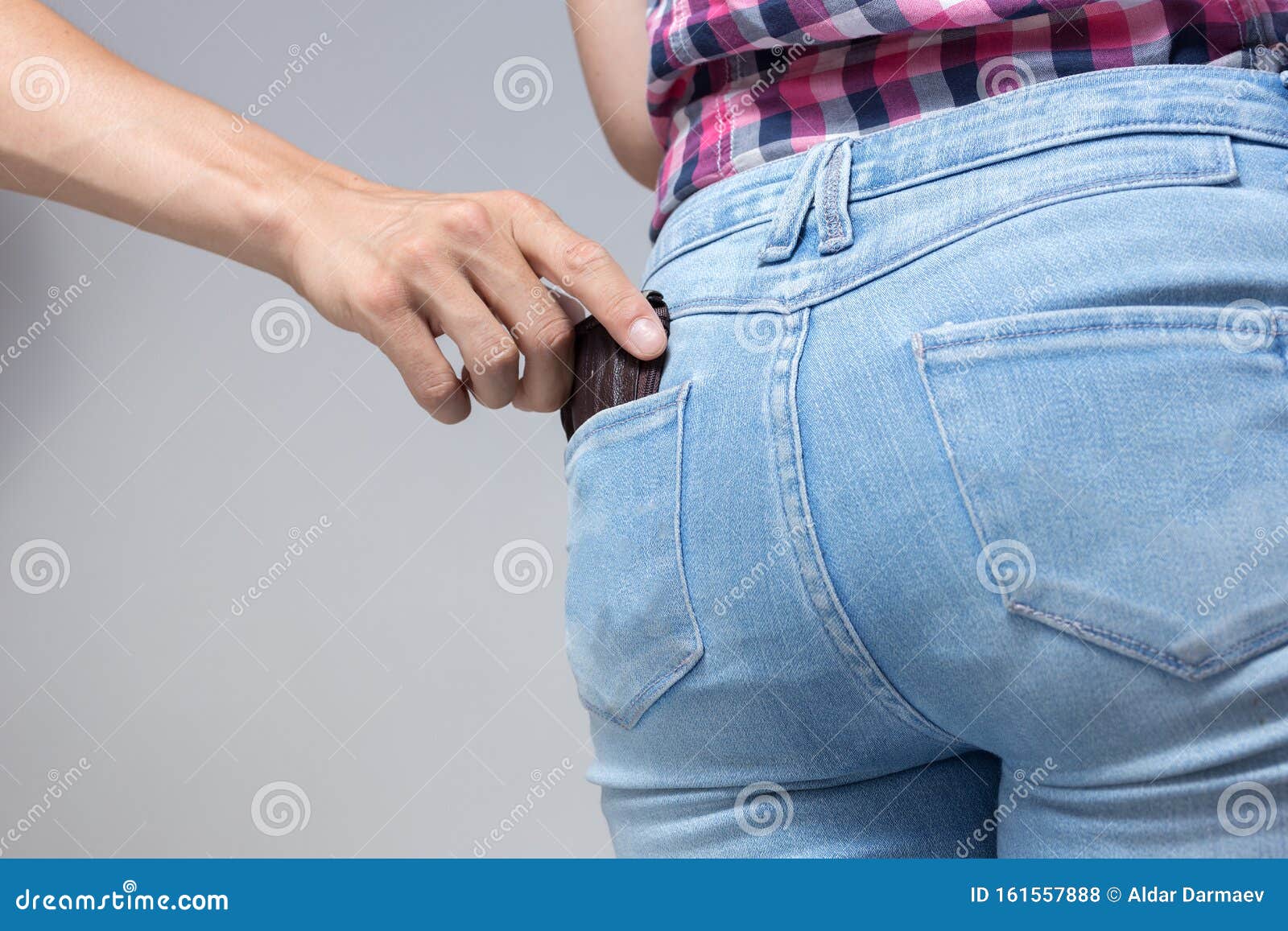 Pickpocketer`s Hand Pulling Stealing Wallet Out Of The Back Pocket