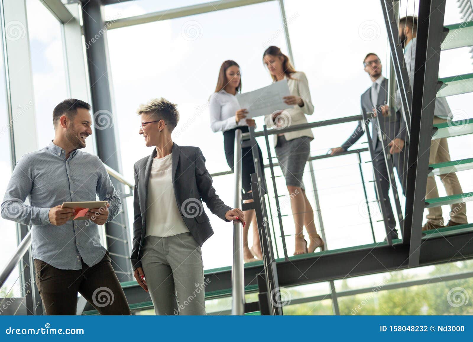 Picture of Architects Talking about Project in Hall Stock Photo - Image ...