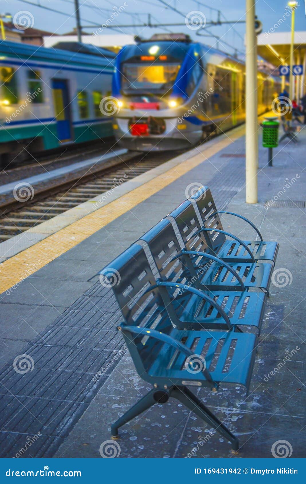 Picture of Bench on the Train Station with Blurred Train Stock Photo ...