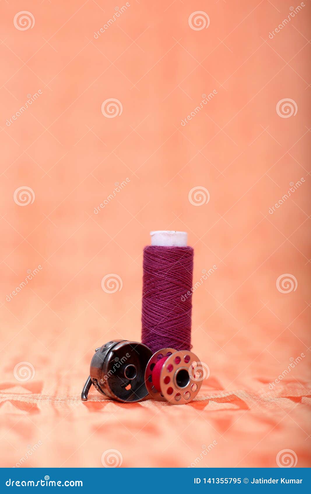 Bobbin Case, Two Bobbin And Two Sewing Thread On The Orange Cloth Stock ...