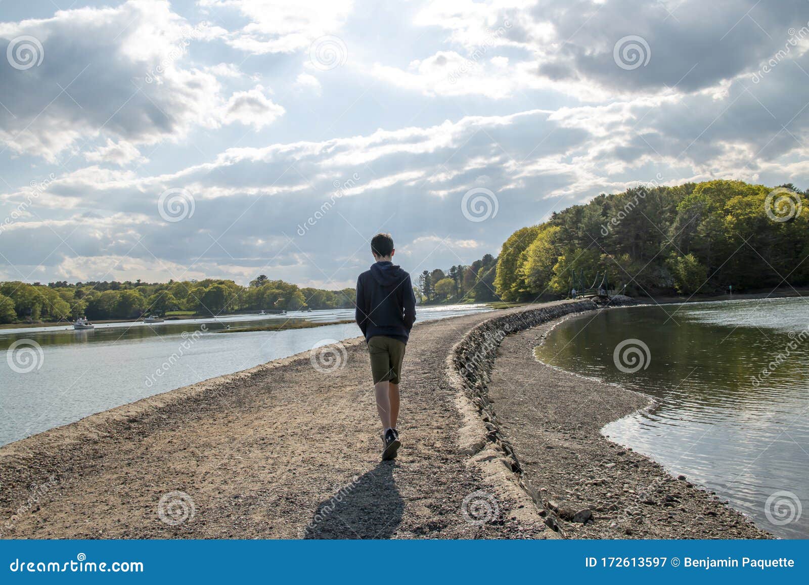 Boy Walking on a Path by the Water Stock Image - Image of young, summer ...